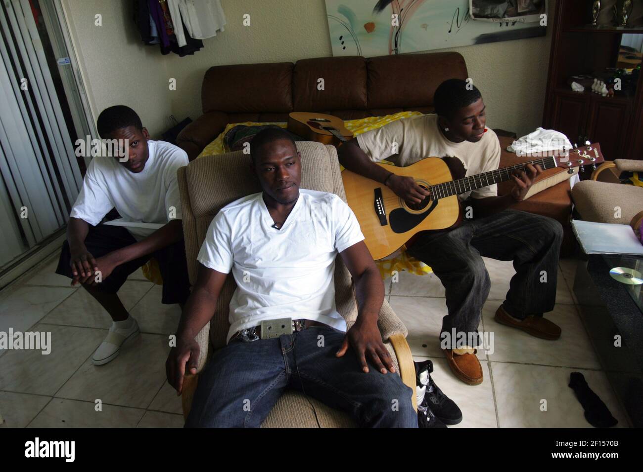 Jeano Michel, 18, from left, Sam Michel, 20, and Edson Jean, 18, jam in ...