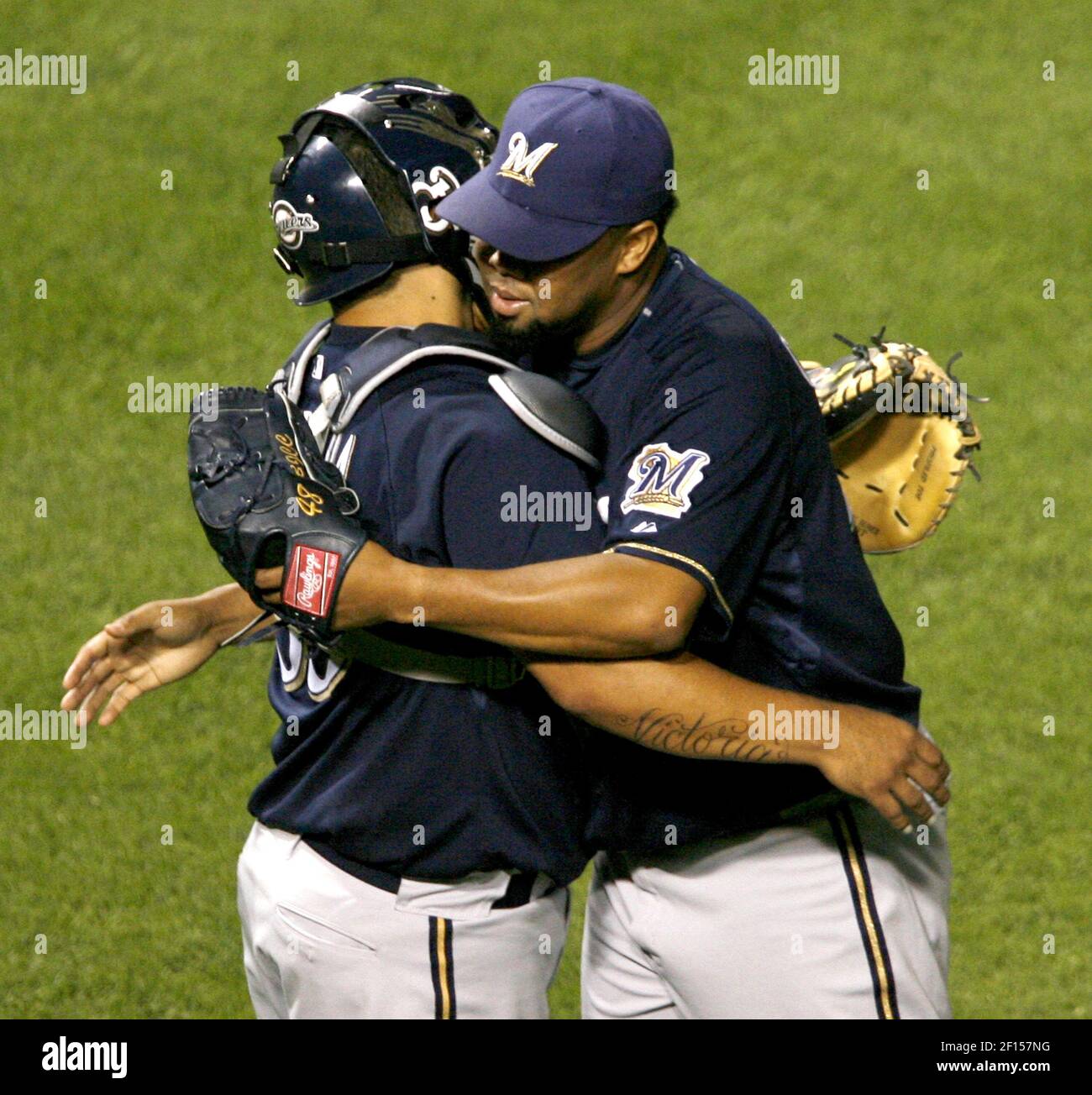 Milwaukee Brewers' Francisco Cordero hugs catcher Johnny Estrada at the ...