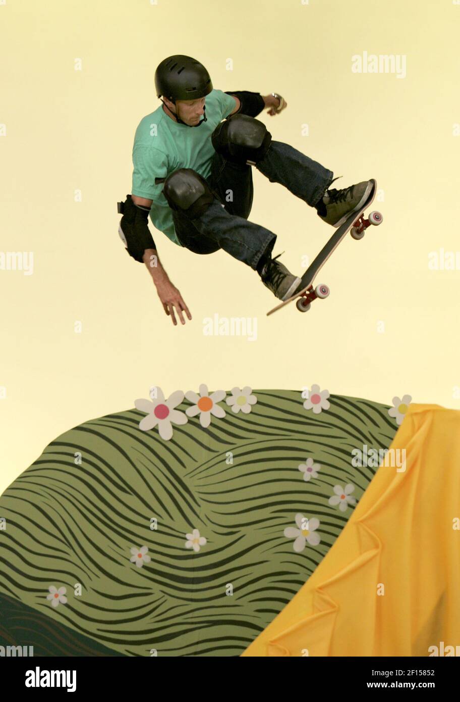 Skateboarding icon Tony Hawk performs on a half-pipe during his guest ...