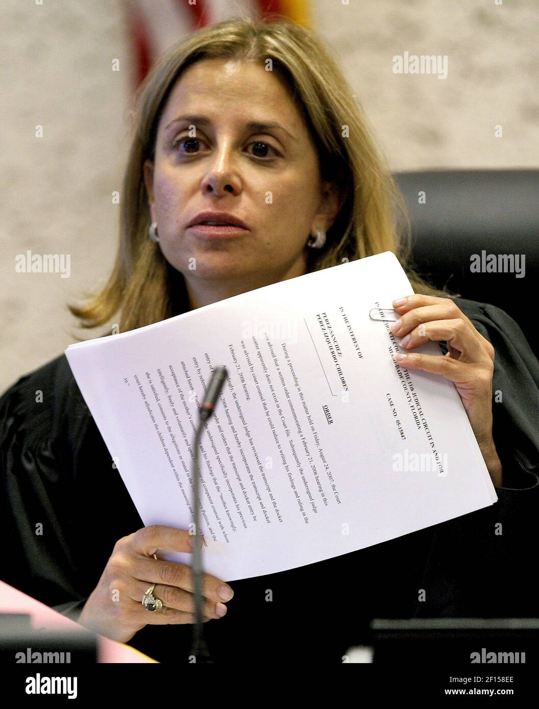 Circuit Judge Jeri Beth Cohen holds up a newly signed order during the ...