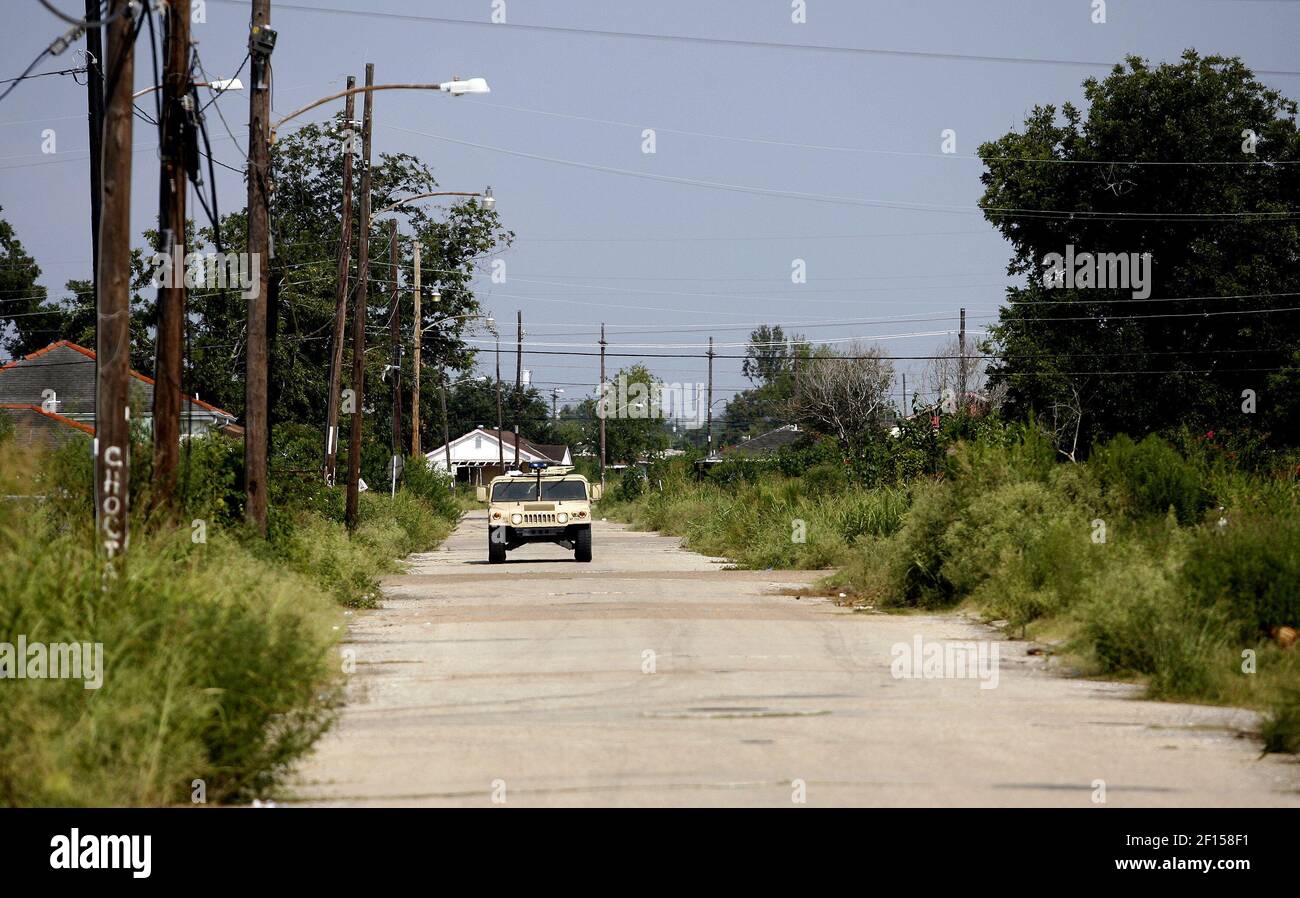 National Guard soldiers patrol the empty streets in New Orleans' Lower ...