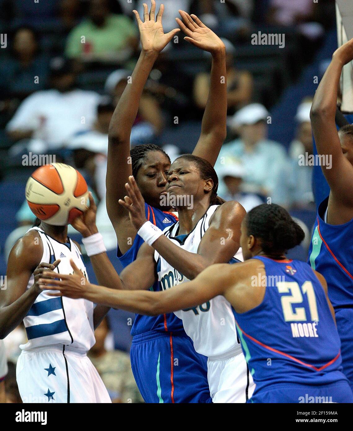 Washington Mystics Nakia Sanford (43) is swarmed by New York Liberty's ...