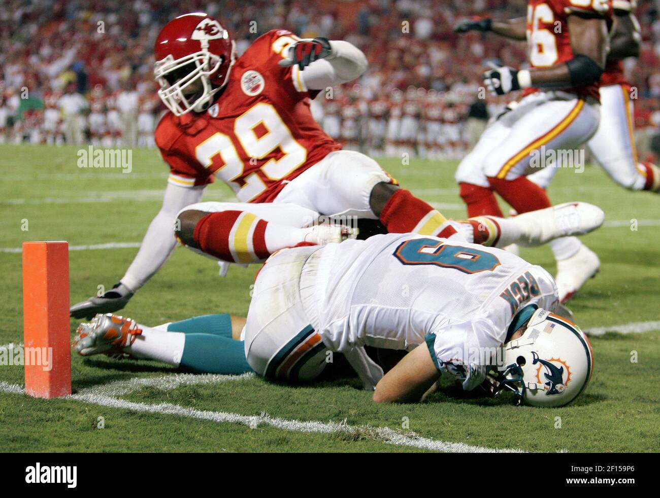 Miami Dolphins quarterback John Beck dives into the end zone for a two ...