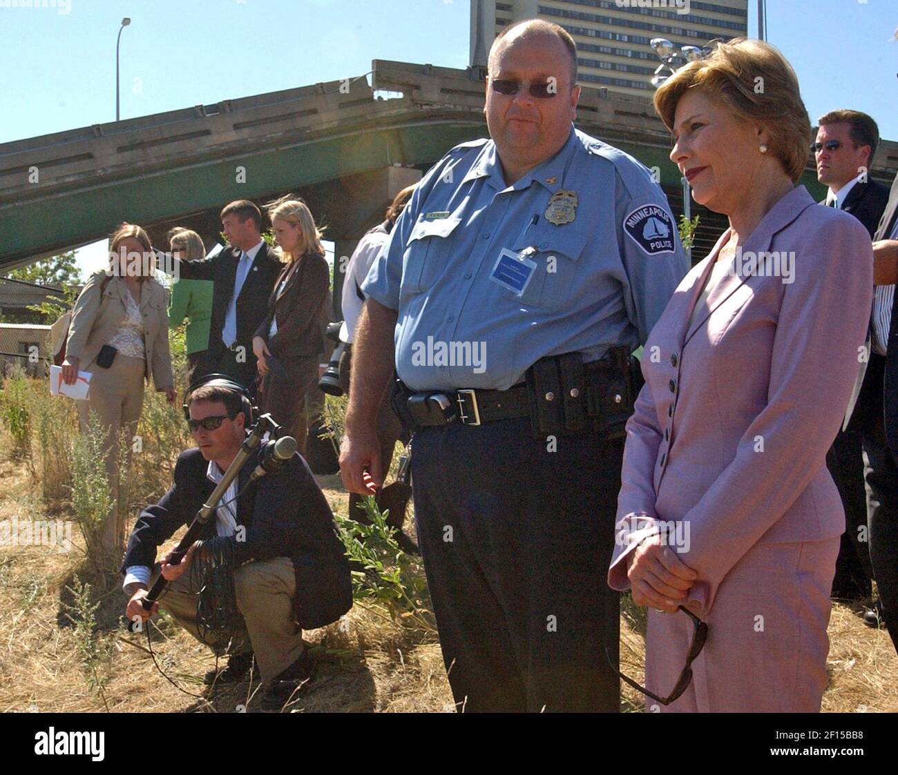 First lady Laura Bush is shown the Minneapolis bridge collapse scene by ...