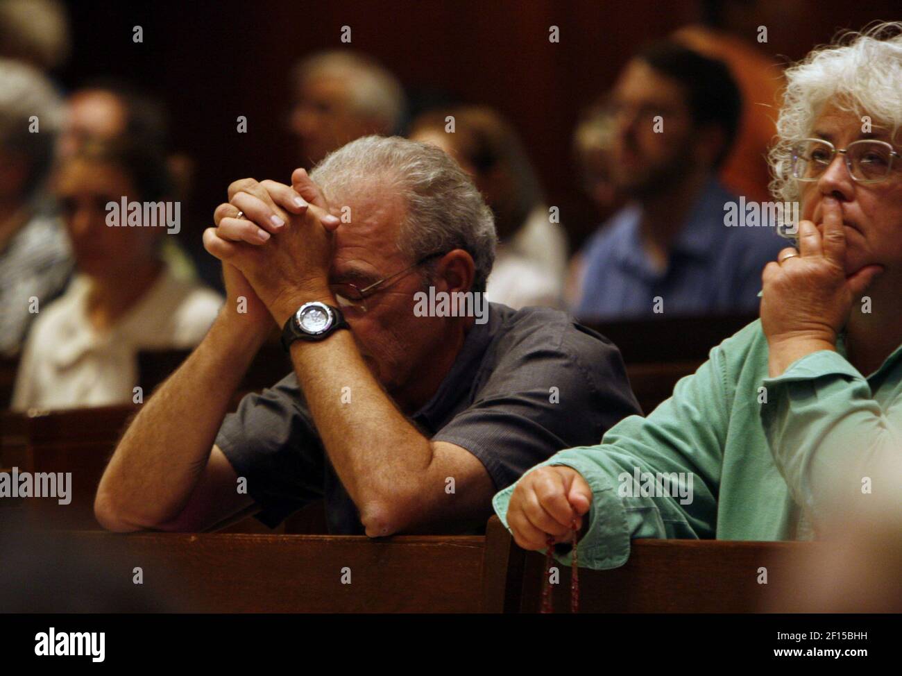 Richard Ketchum, left, and his wife Sharon Marie Francis pray for the ...