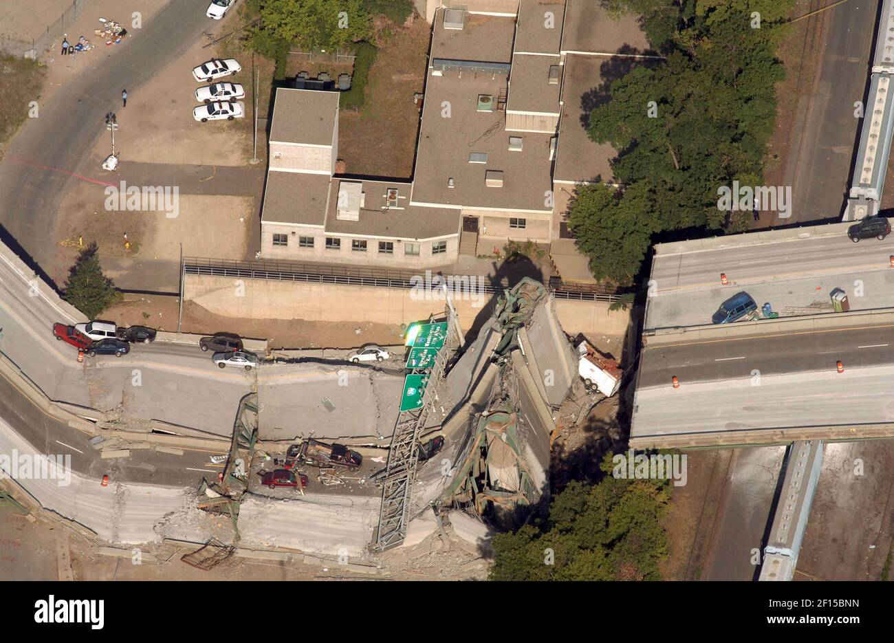 In this aerial view, the collapsed I-35W bridge over the Mississippi ...
