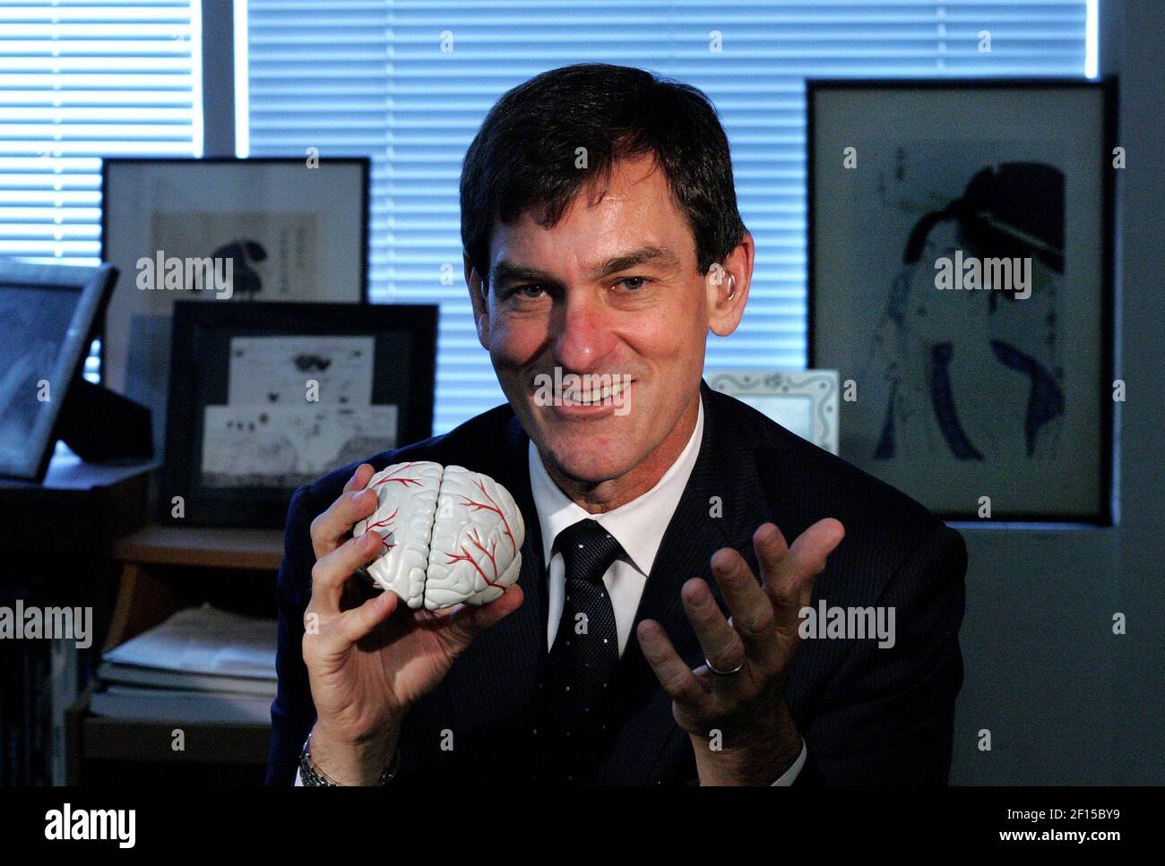 Neurologist William Rodman Shankle holds model of a brain, July 26 ...