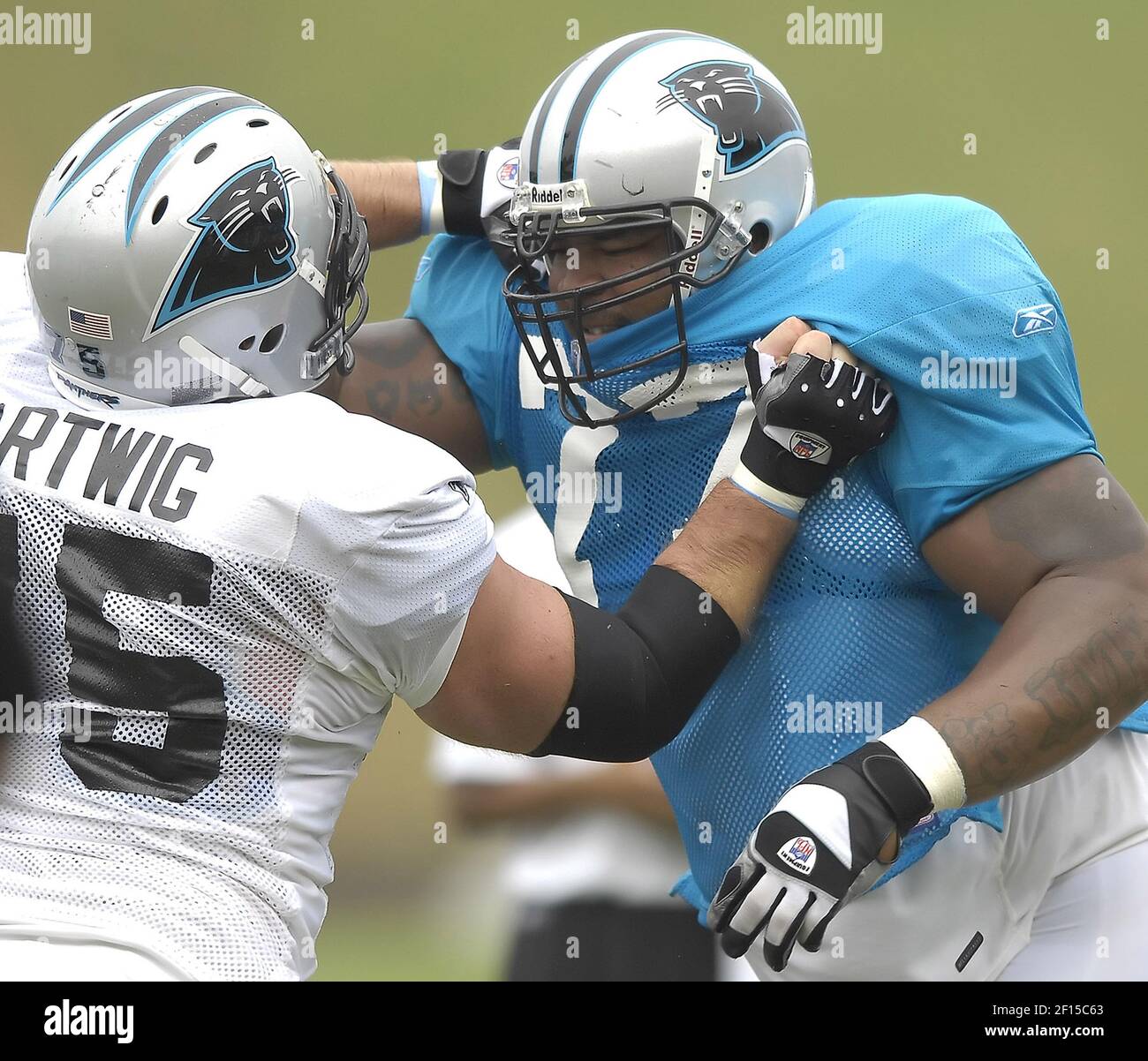 Carolina Panthers center Justin Hartwig and defensive tackle Kris ...