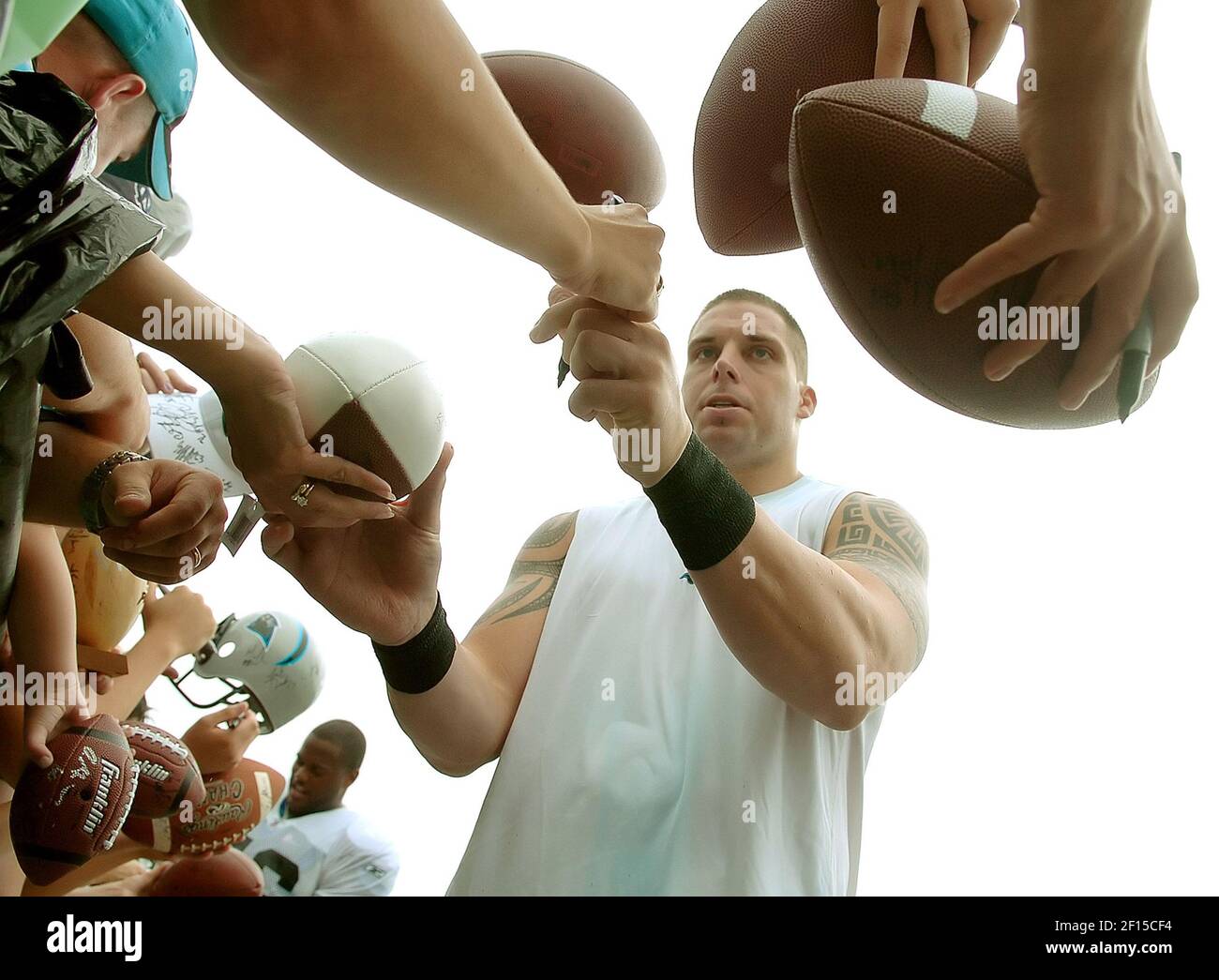 Carolina Panthers linebacker Dan Morgan reaches out to sign autographs ...