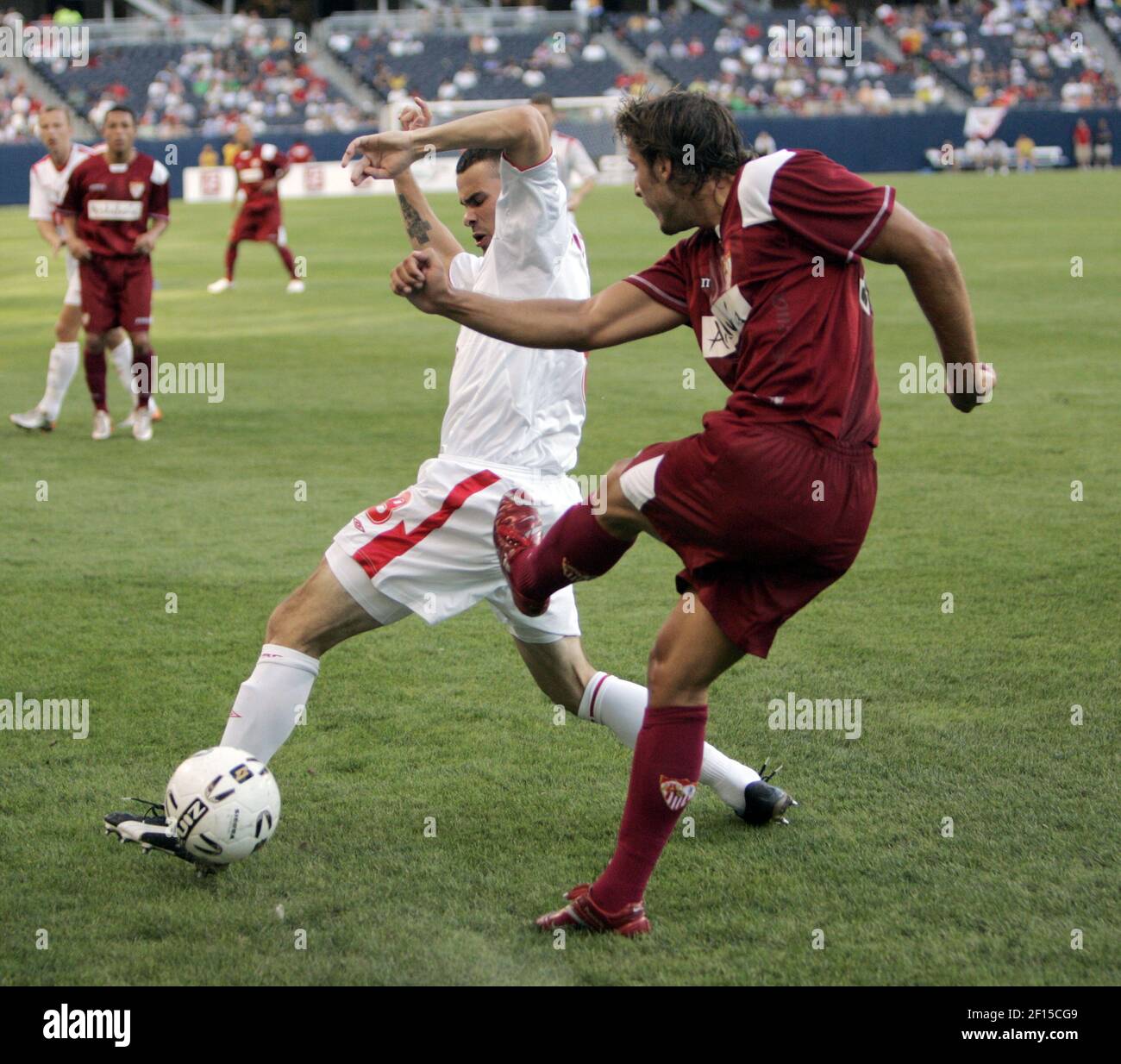 Sevilla's Antonio Jose Puerta (right) fires the ball off the leg of ...