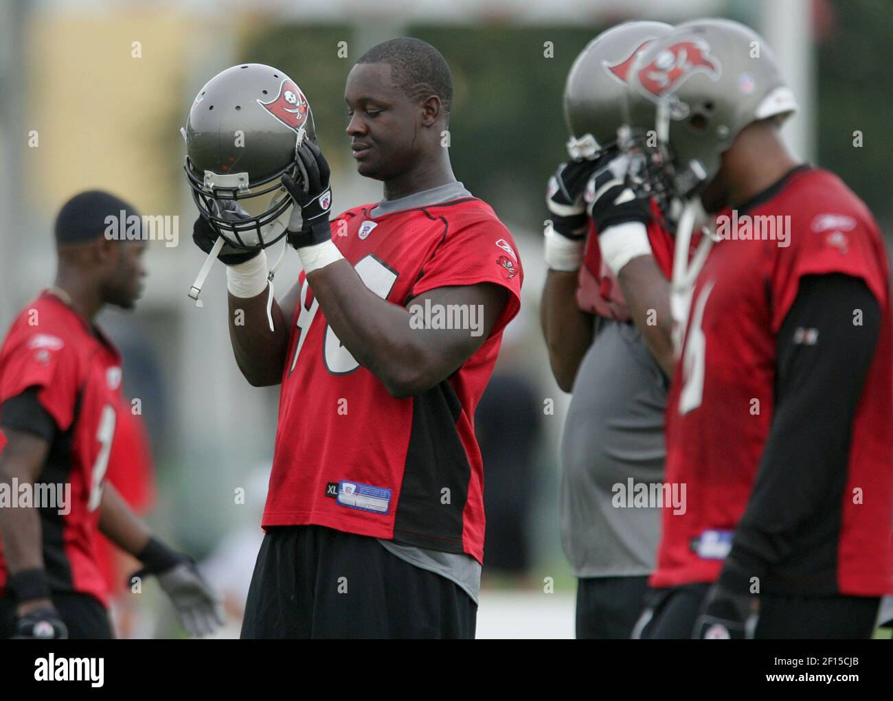 Tampa Bay Buccaneers' Gaines Adams (90) puts his helmet on during ...