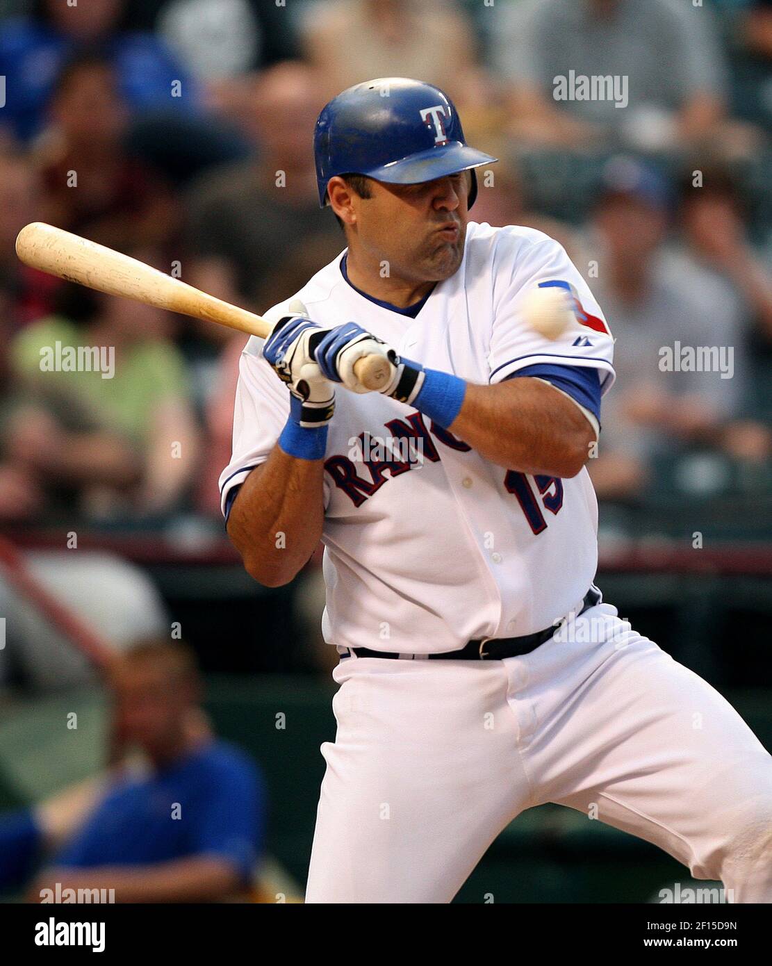 Texas Rangers' Gerald Laird is hit by a pitch from Cleveland Indians ...