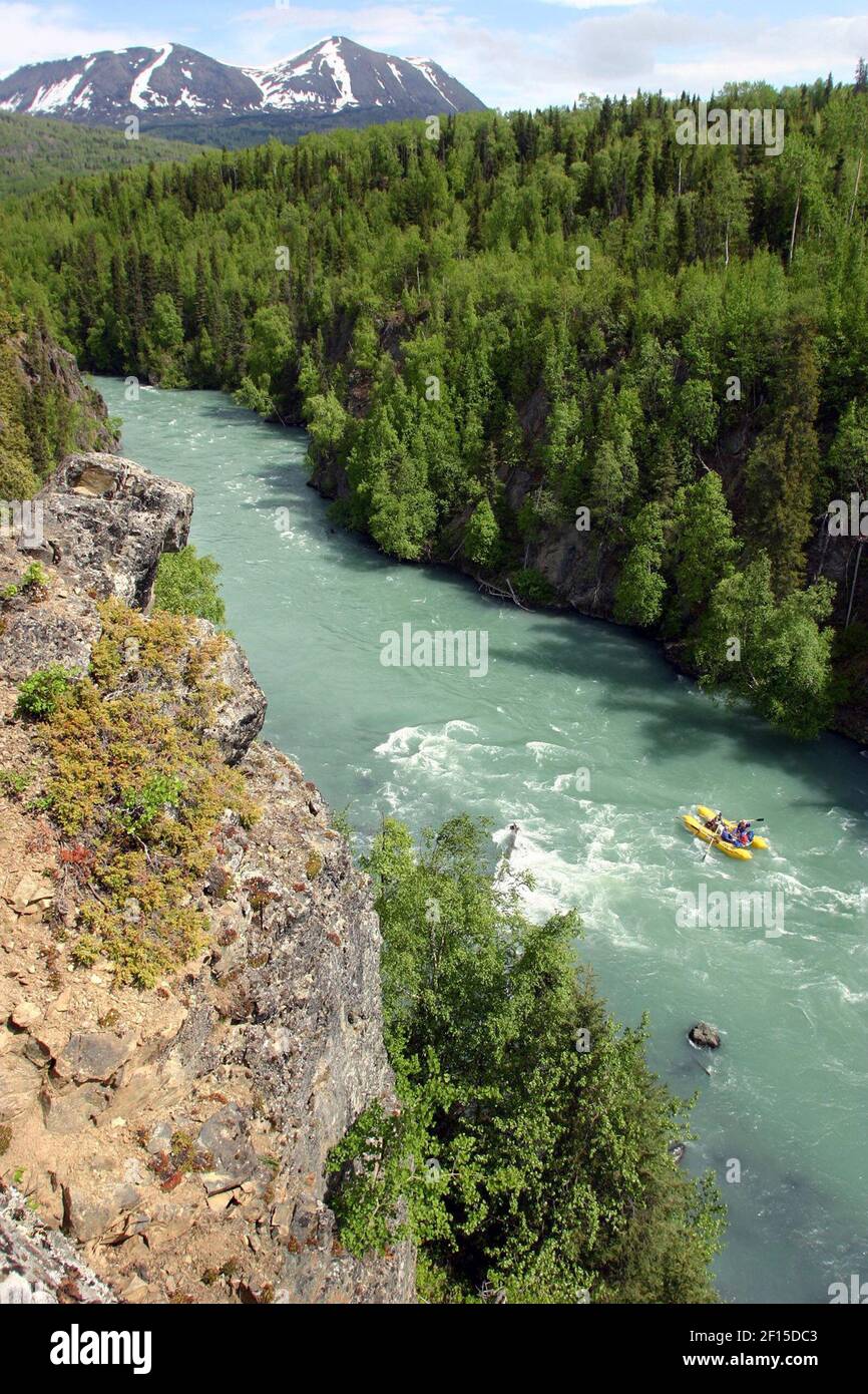 A pontoon raft heads through the canyons on the upper Kenai River in ...