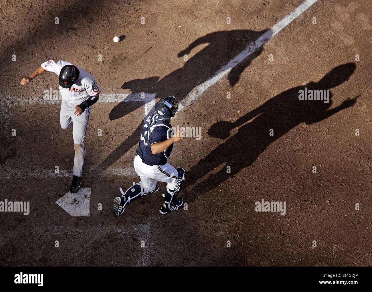 The San Francisco Giants' Randy Winn scores as the ball gets away from ...