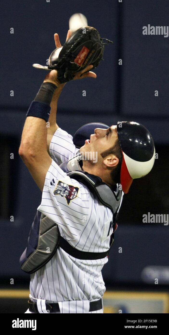 Minnesota Twins' Joe Mauer catches a foul ball from Oakland Athletics ...