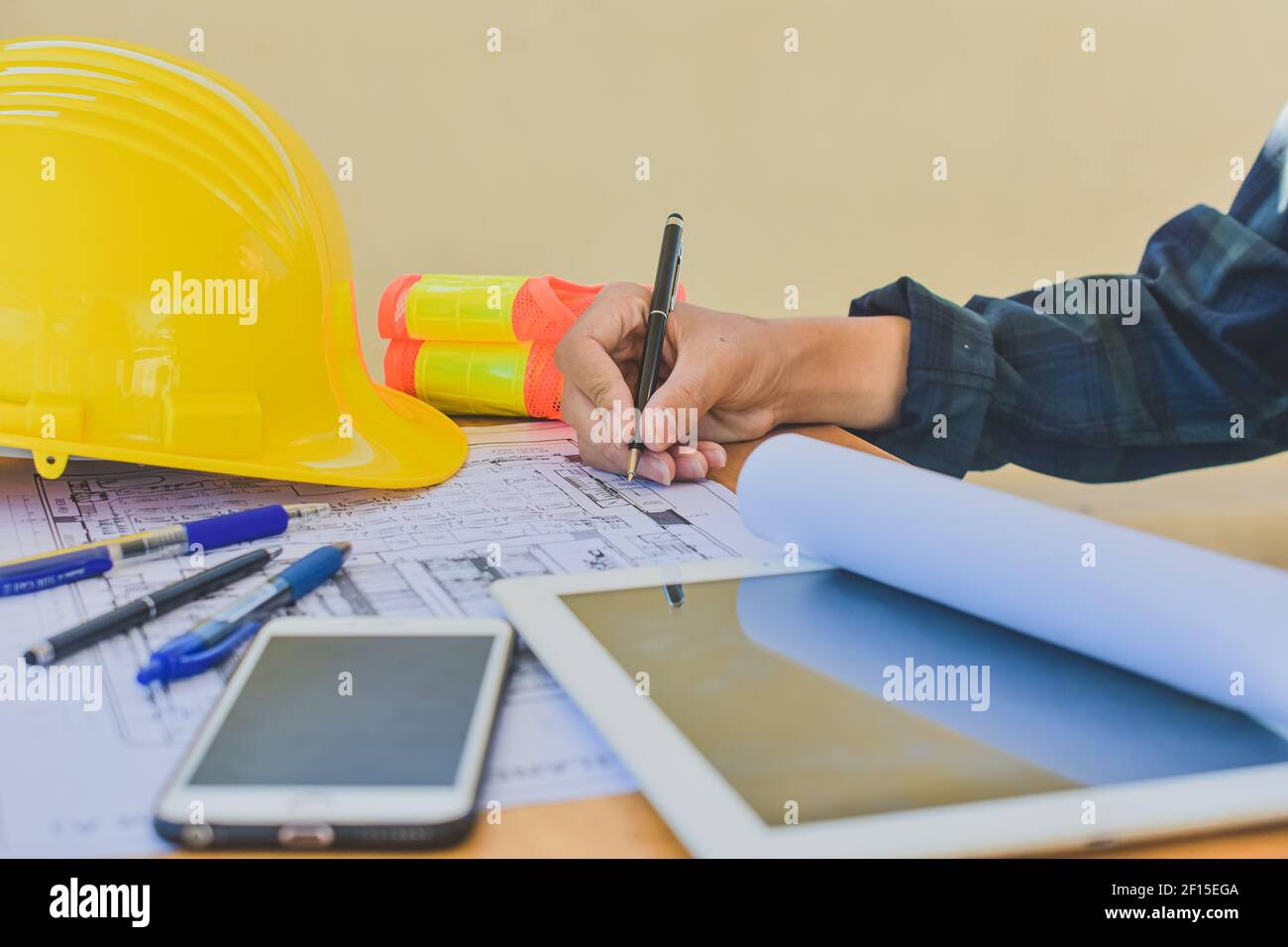 Close up hand check design on blueprint for building construction ...