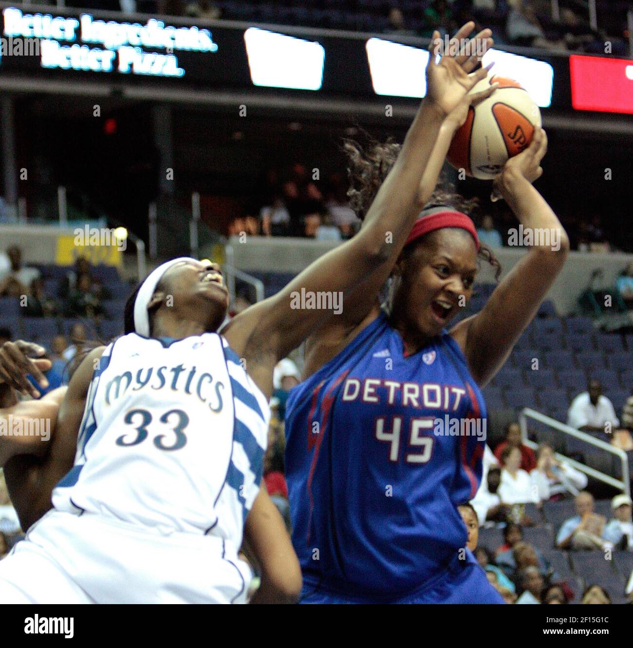 Detroit Shock Kara Braxton (45), right, battles for a rebound with Washington Mystics Bernice ...