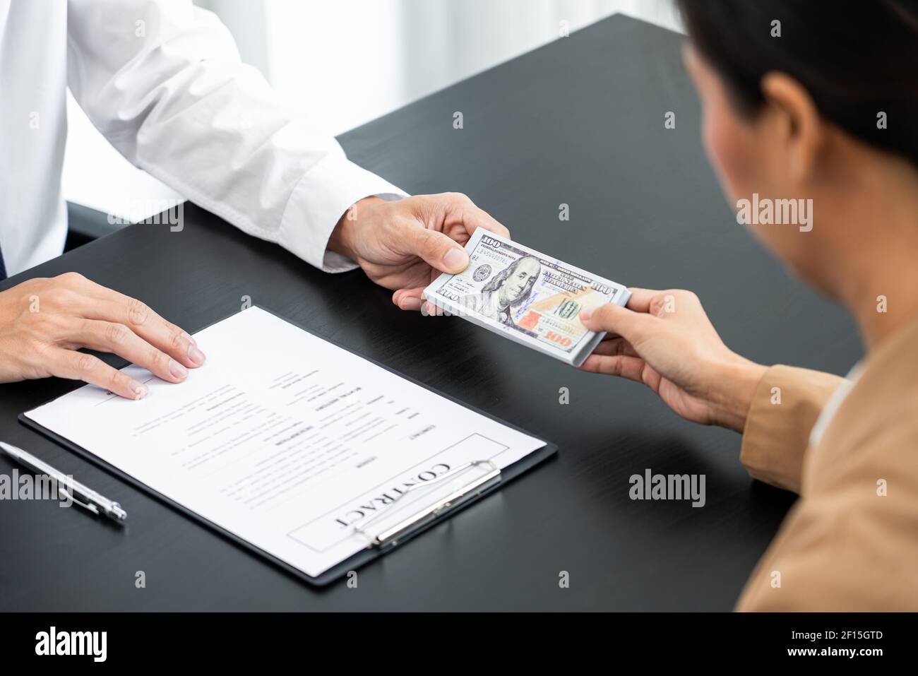 Businessmen give money to bribe partner secretly passing money, bribery ...