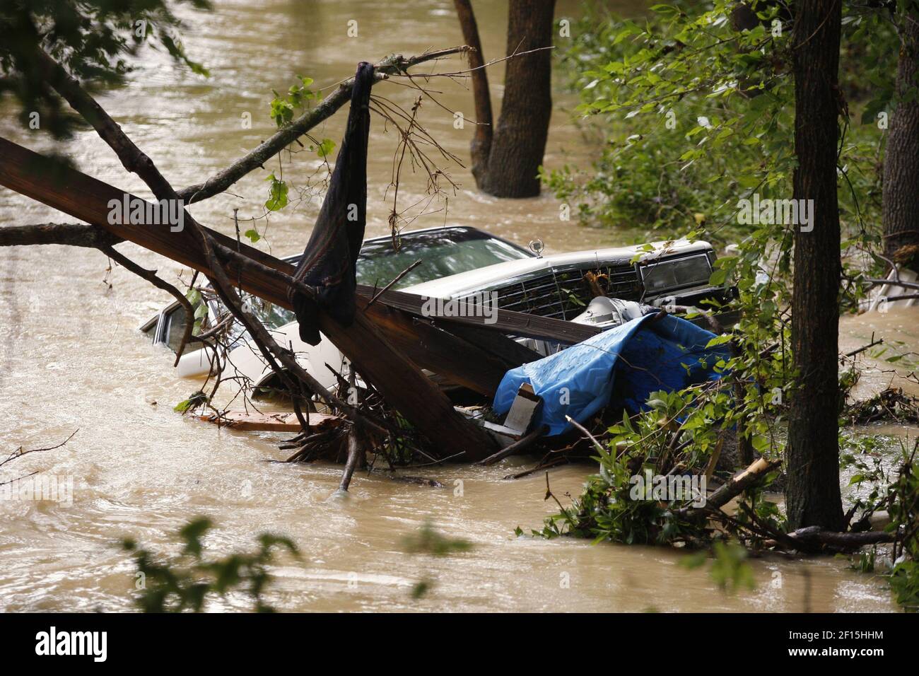Sam Gerard's Cadillac rests in a swollen creek downstream from where ...
