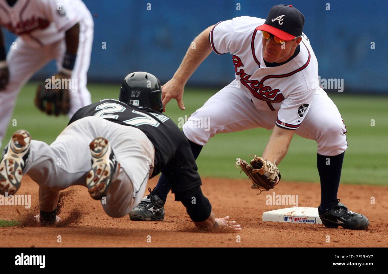 Atlanta Braves second baseman Pete Orr reaches to tag Florida Marlins ...