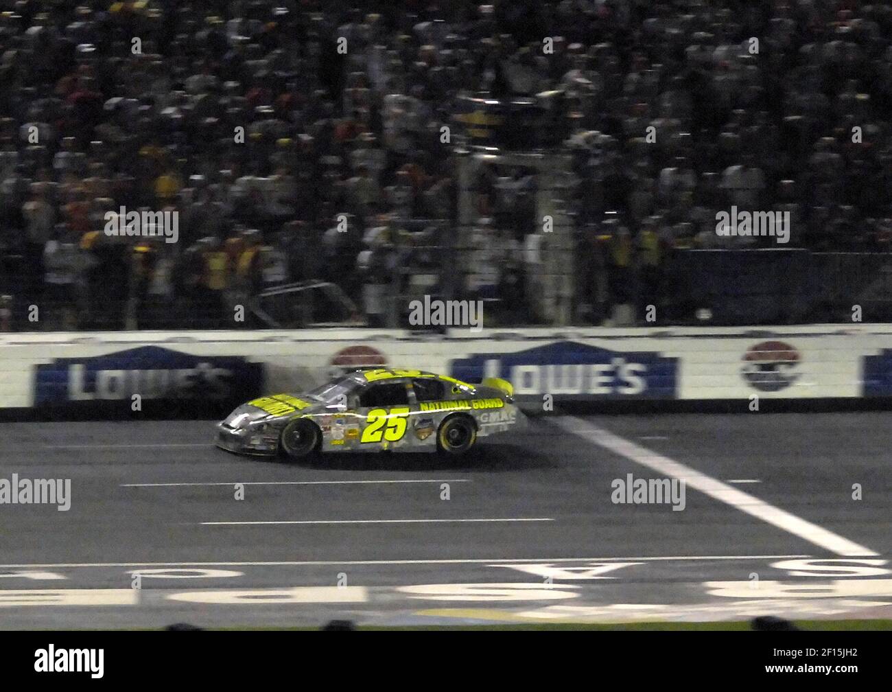 Casey Mears (25) crosses the Start/Finish line to win the Coca-Cola 600 ...