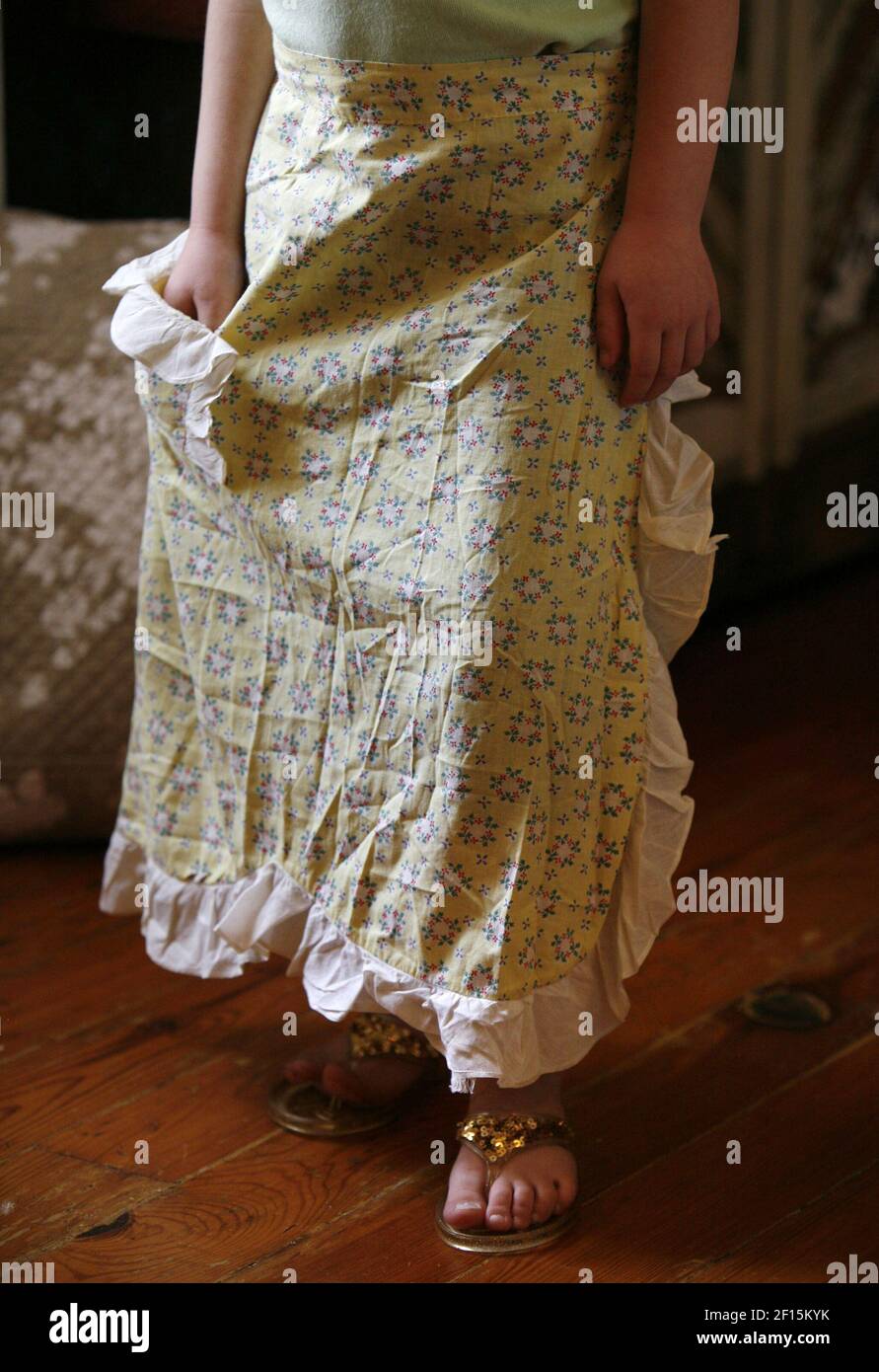 Libby Johnson, 5, models a vintage apron at Finders Keepers shop in Mt ...