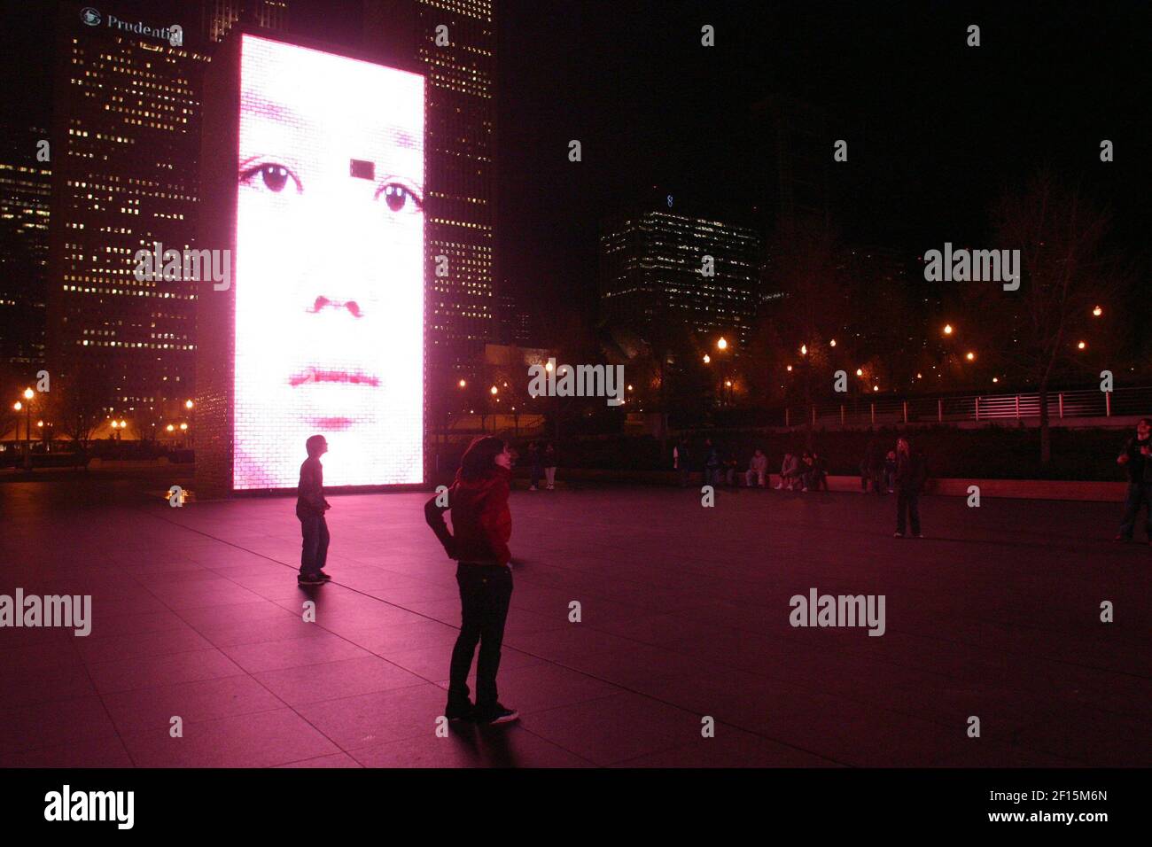 A pair of 50-foot-high glass towers that have a revolving display of ...