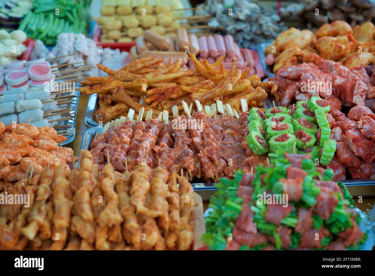Selection of snacks laid out on a market stall, Sapa, Lao Cai Province ...