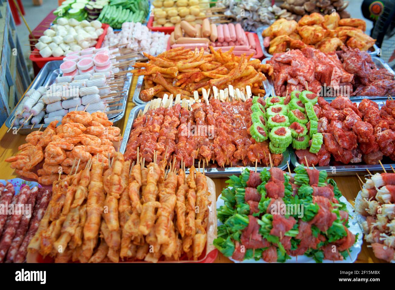 Selection of snacks laid out on a market stall, Sapa, Lao Cai Province ...