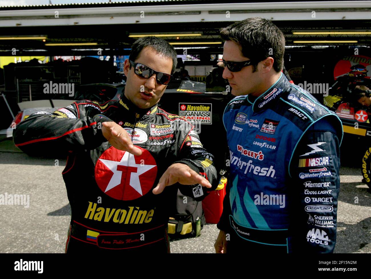 Pablo Montoya, left, and David Stremme, right, talk during Busch series ...