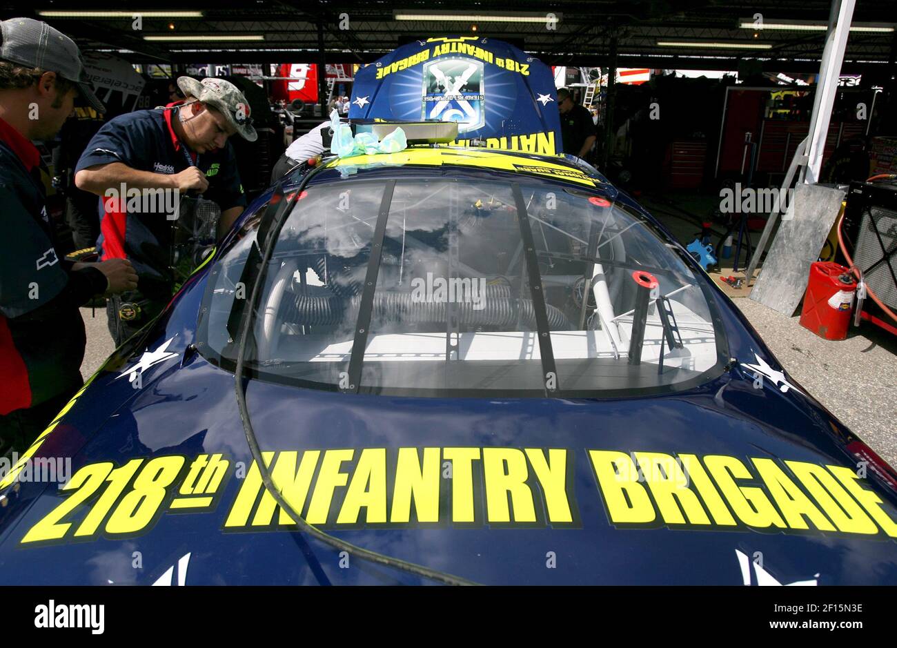 The National Guard crew works on their car before the Busch series ...
