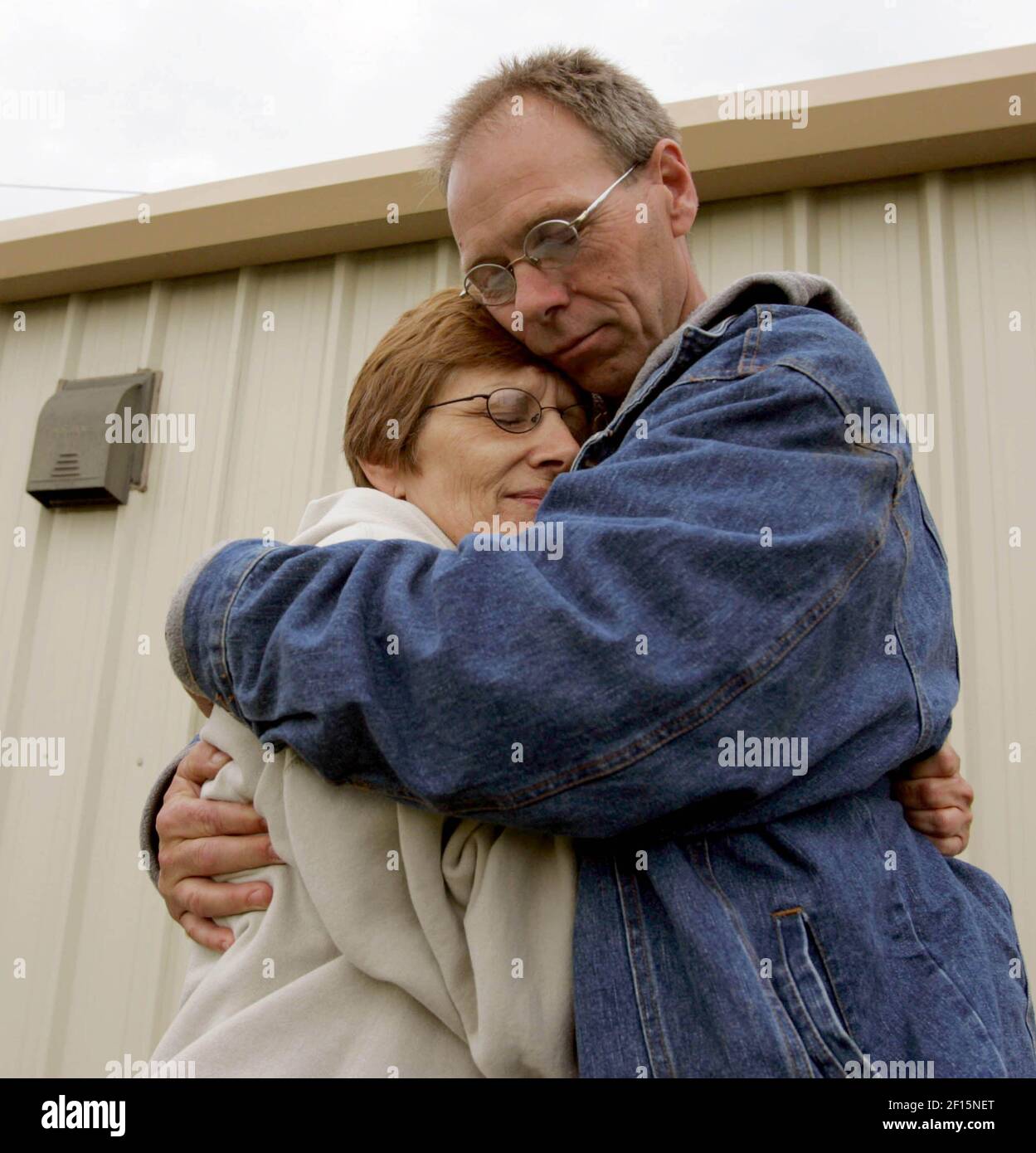 David and Diann Rogers embrace Sunday outside a relief shelter in ...