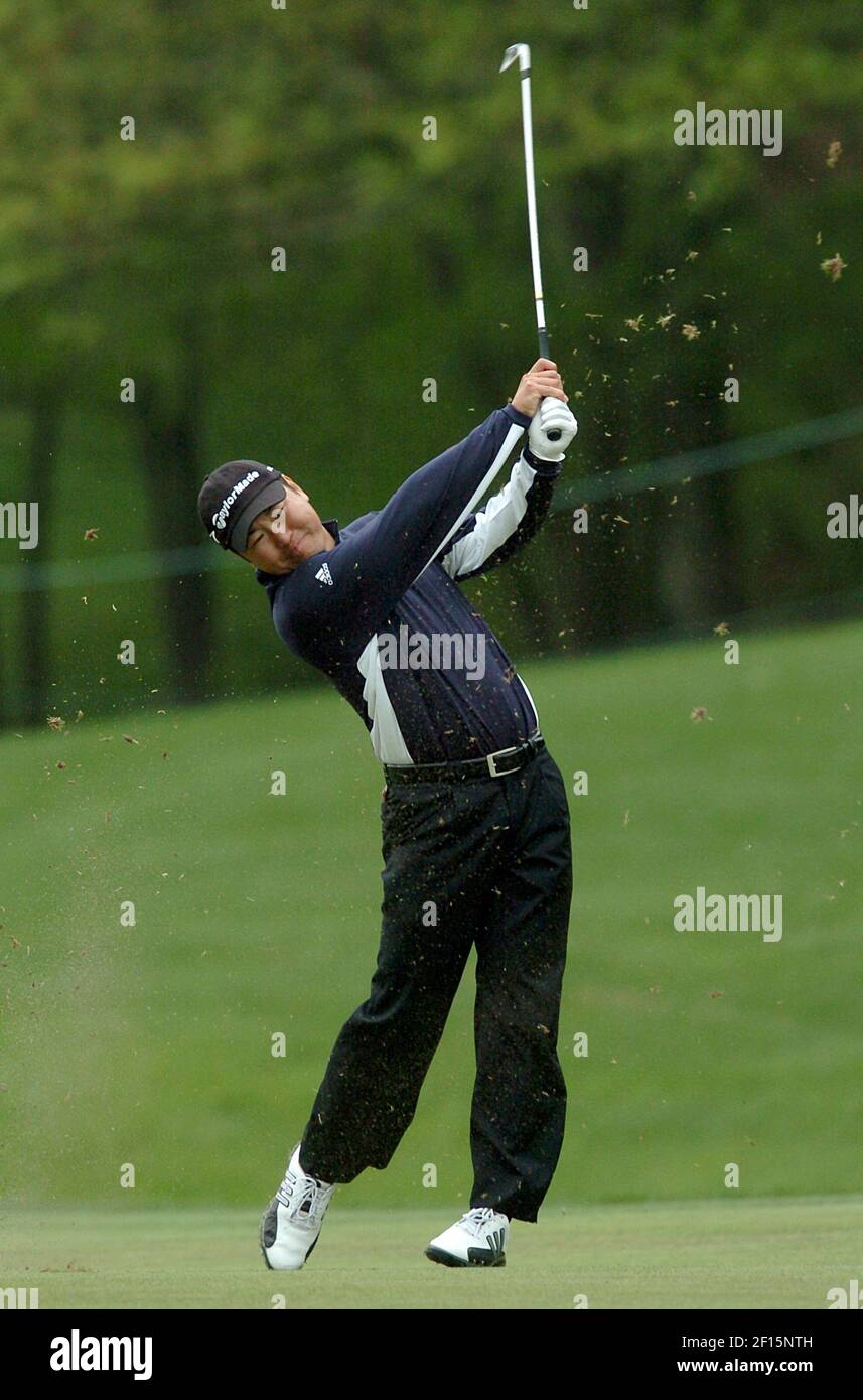 Charlie Wi follows through on a swing from the 18th fairway during ...