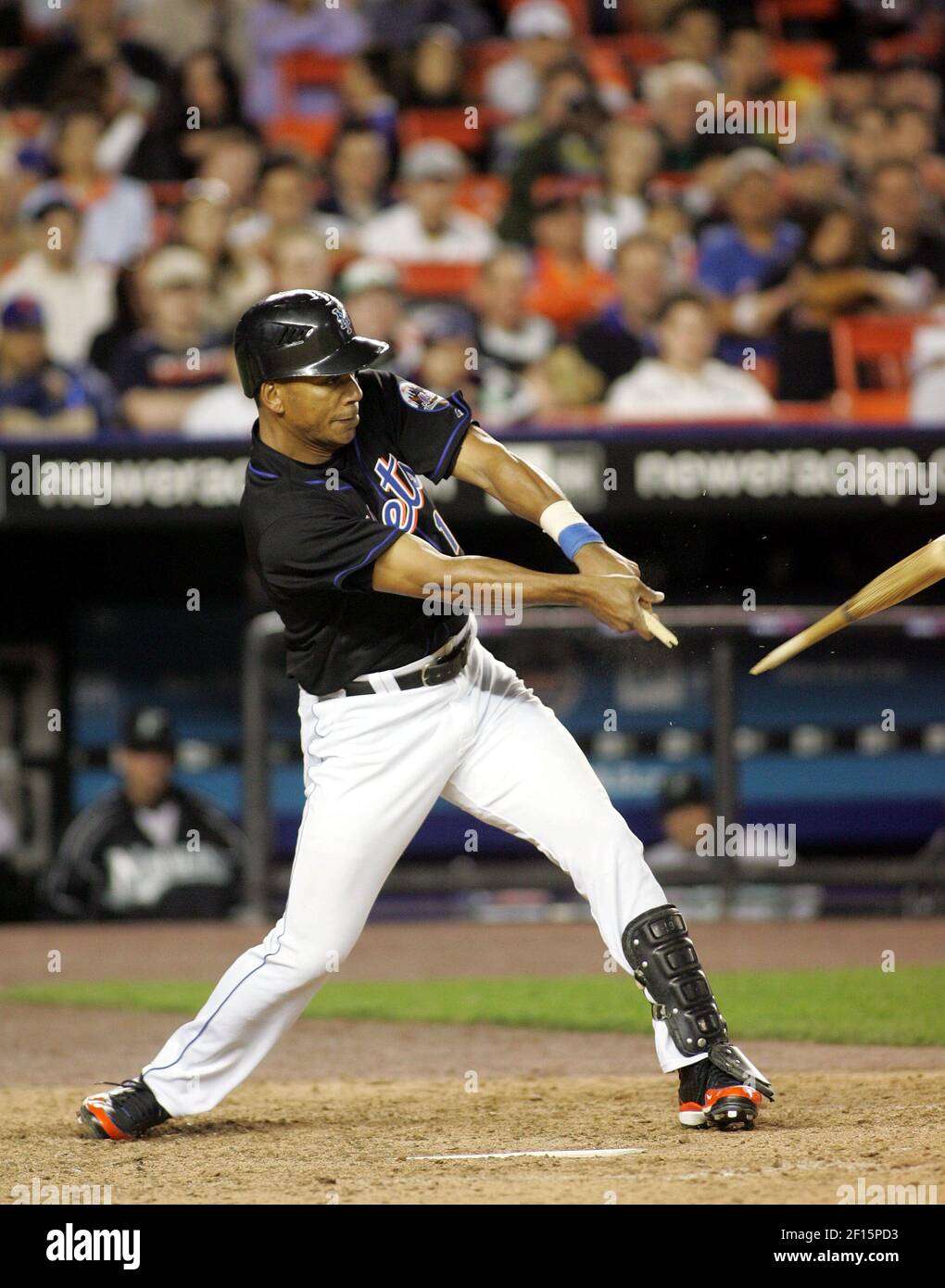 The New York Mets' Moises Alou breaks his bat as he hits into an inning ...