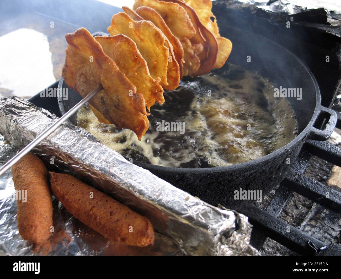 An alcapurria fries in a deep, cast iron pot at Tropical Heat, a small ...