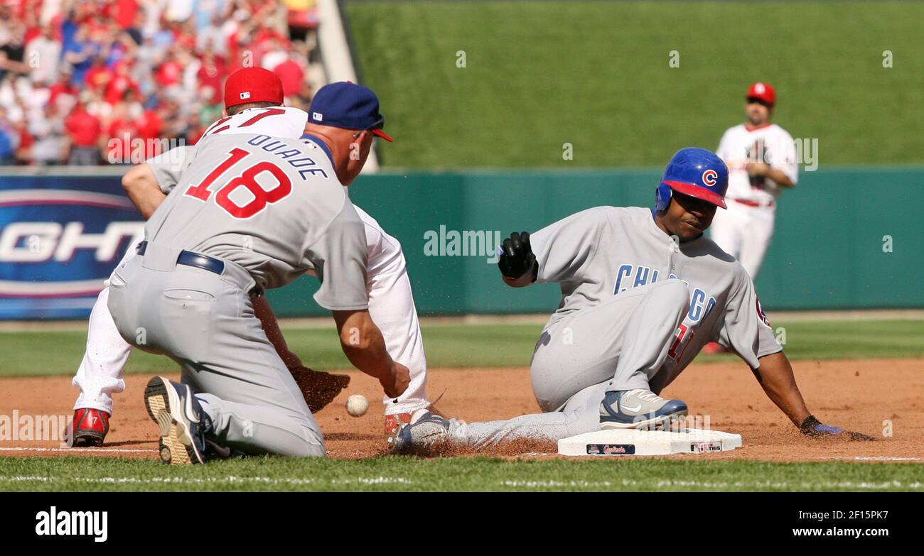 Chicago Cubs' Jacque Jones slides safely into third base under the ...
