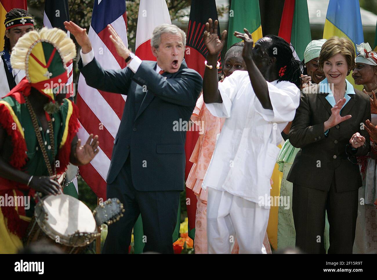 President Bush and first lady Laura Bush, right, dance with Medoun ...
