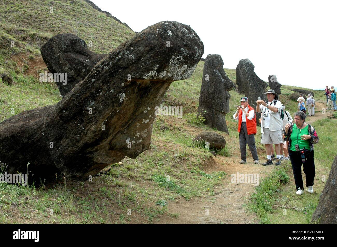 Tourists stop to admire the massive stone sentinels of Ahu Tongariki on ...