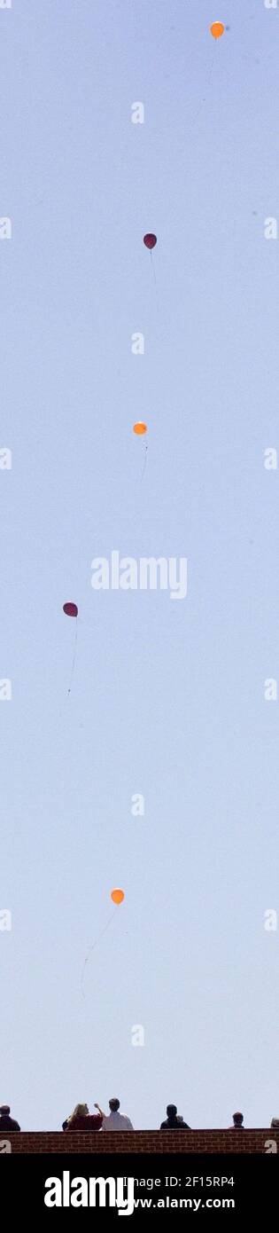 Employees at Northrop Grumman Newport News watch as balloons ascend ...