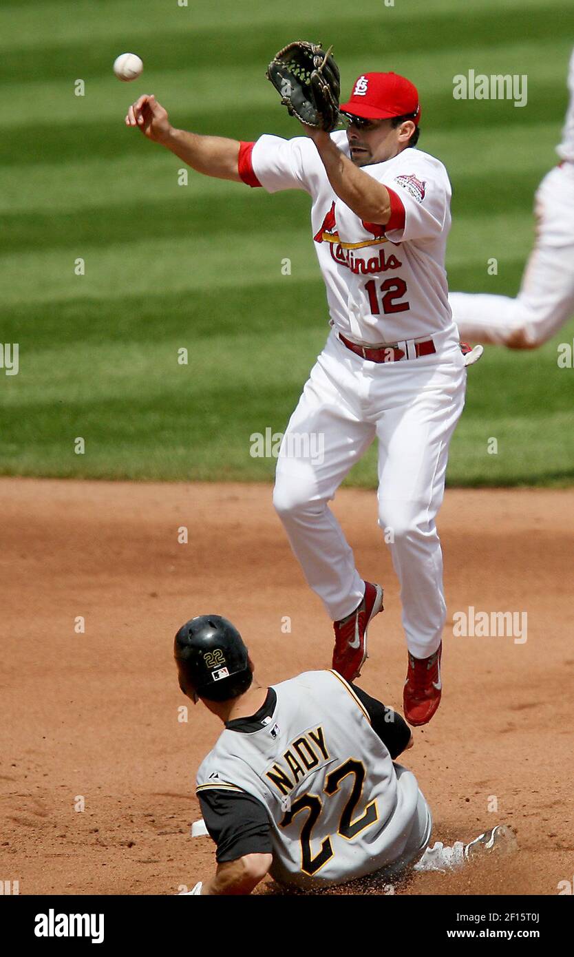 St. Louis Cardinals second baseman Aaron Miles leaps to catch a high ...