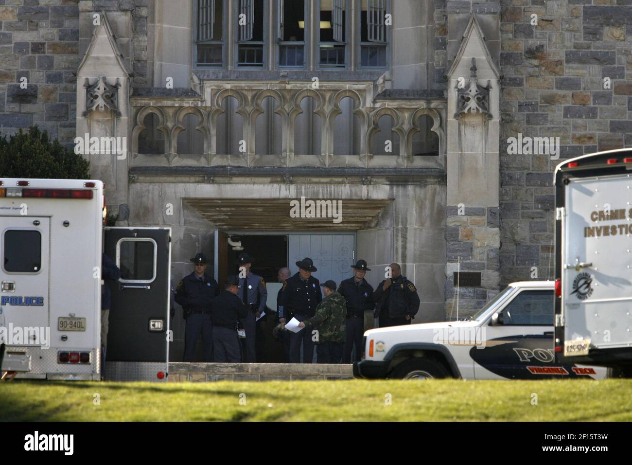 Police offiers stand outside of Virginia Tech's Norris Hall where 32 ...