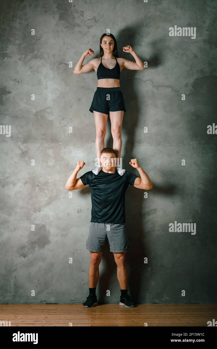 Silhouette man helping woman climb hi-res stock photography and images - Alamy