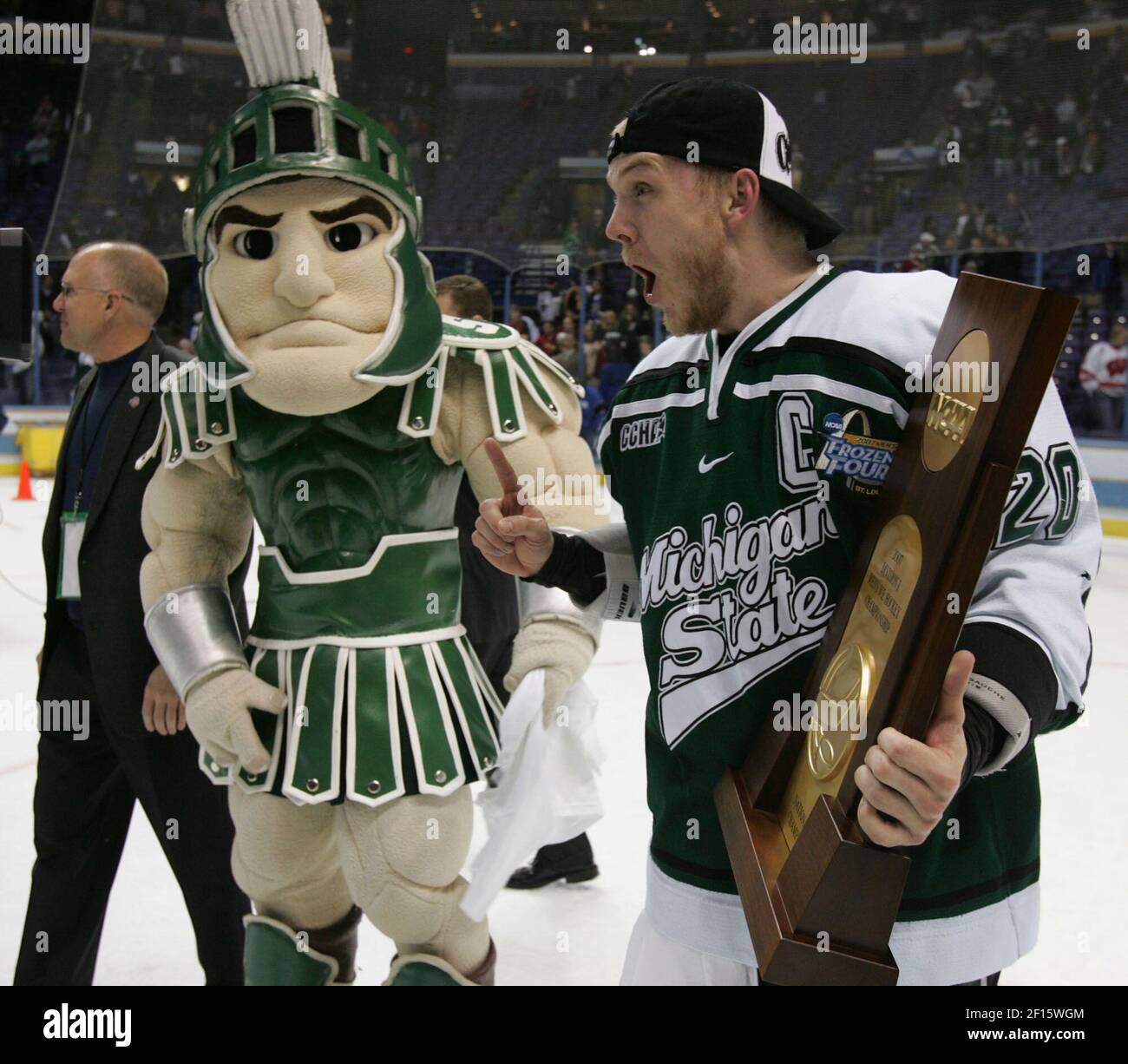 Michigan State captain Chris Lawrence, right, celebrates his team's win ...