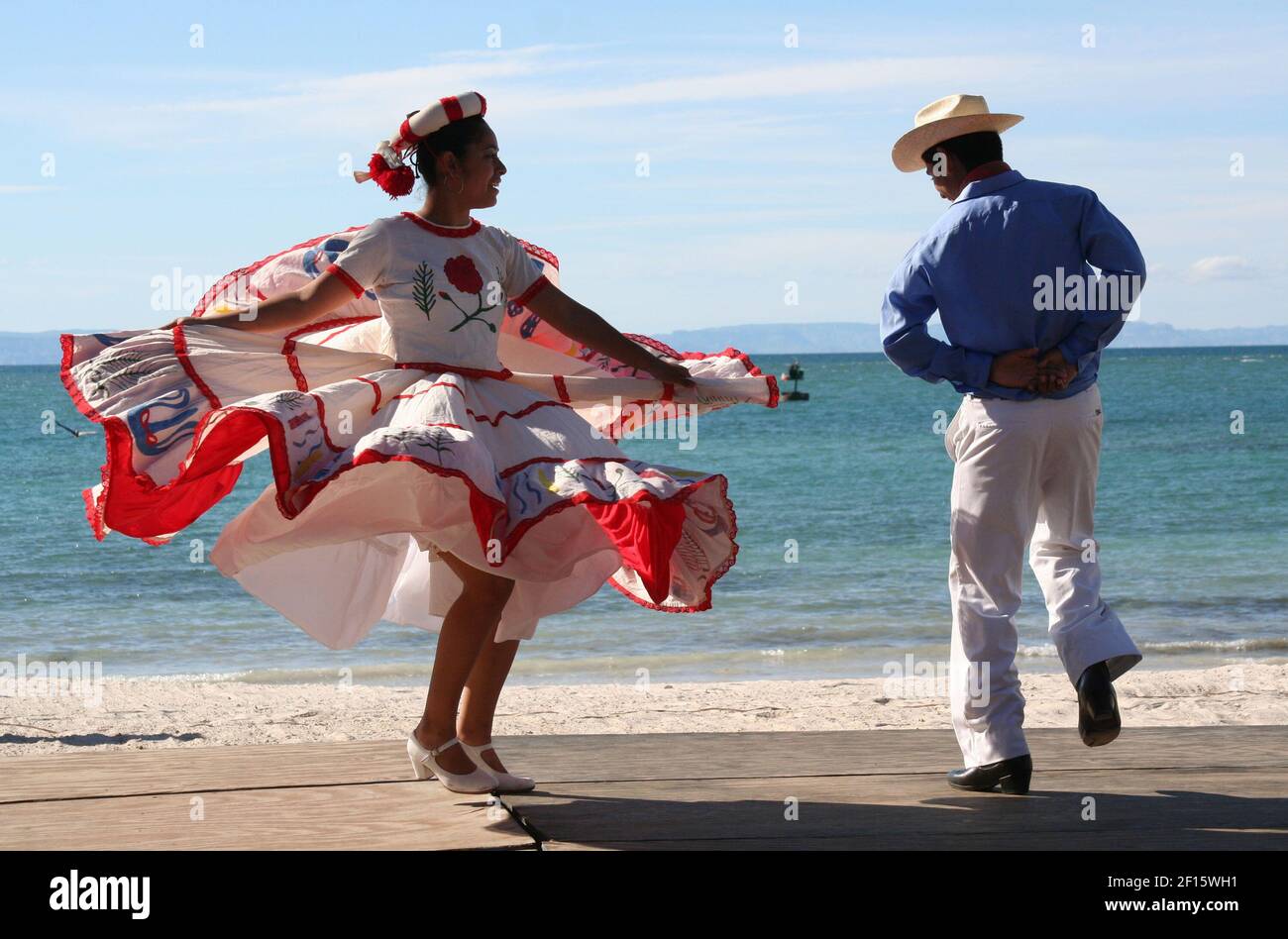 Dancers on a makeshift stage perform during a custom fiesta for ship's ...
