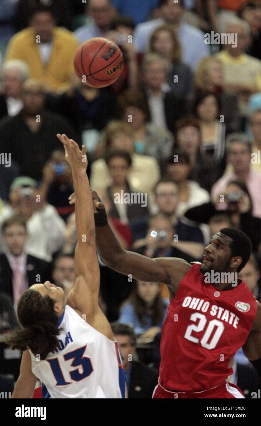 Florida's Yoakim Noah (13) and Ohio State's Greg Oden tip off the NCAA ...