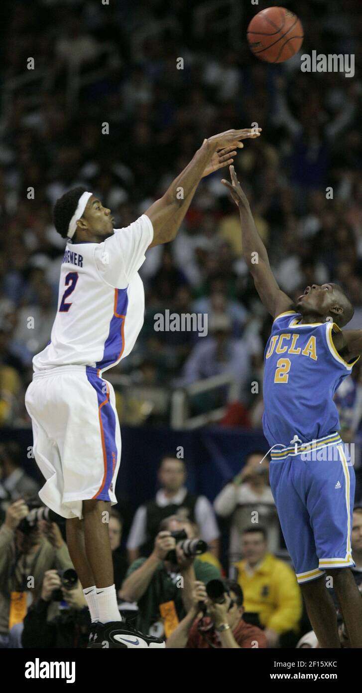 Florida's Corey Brewer (left) shoots over UCLA's Darren Collison in the ...