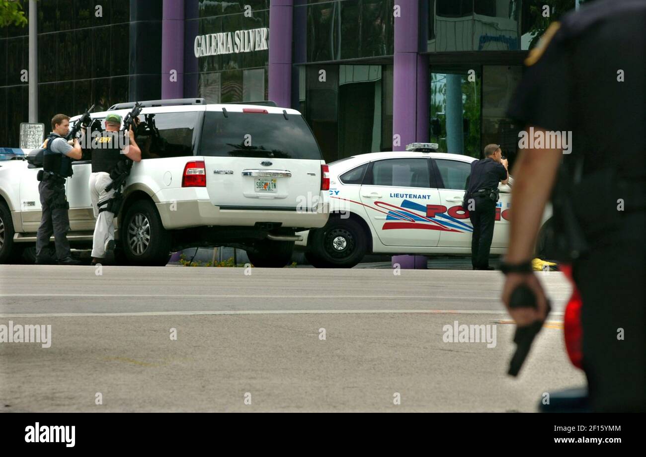 Miami Beach Police and the FBI guard the front of the Sheridan Center ...