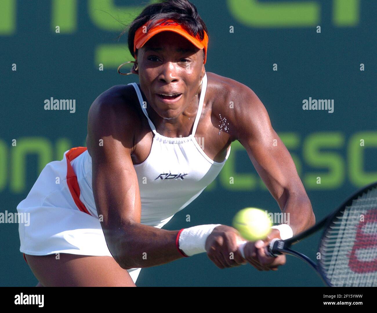 Venus Williams hits a shot during the match against Maria Sharapova ...