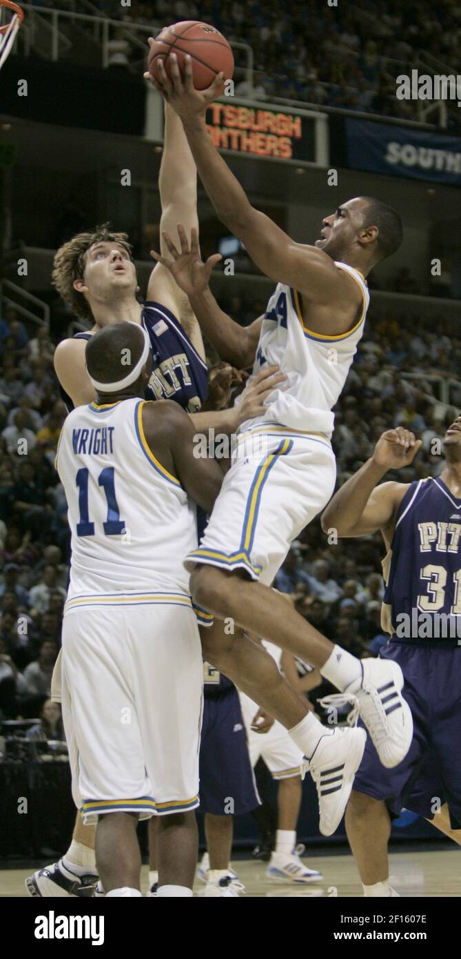 UCLA's Arron Afflalo takes a shot against Pittsburgh's Aaron Gray in ...