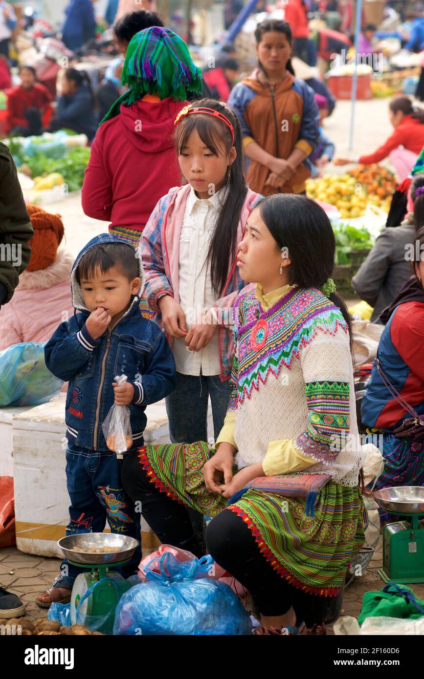 Flower Hmong family in a mixtue of traditional style and modern attire ...